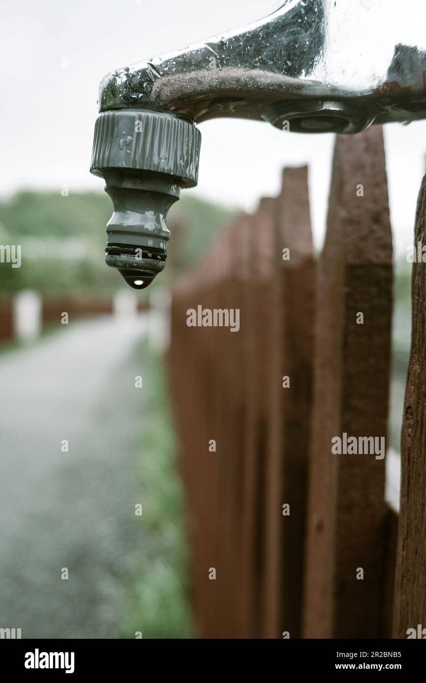 a drop from an outdoor water tap Stock Photo - Alamy