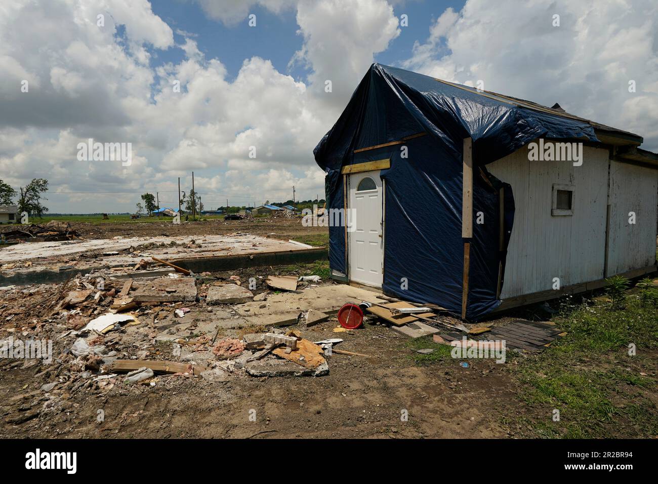 A heavily tarped shed is all that is left of this home in Silver City ...