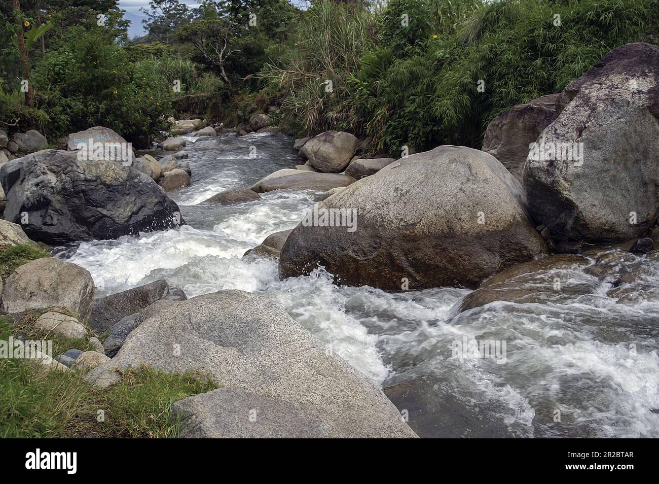 Papua New Guinea; Eastern Highlands; Goroka; A rushing mountain river ...