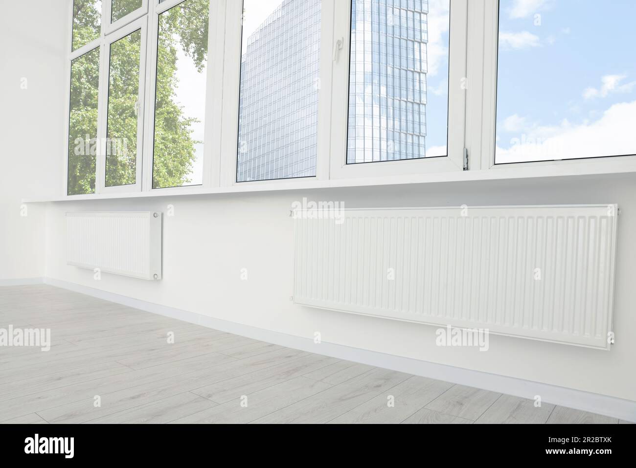 Modern office room with radiators and windows. Interior design Stock ...