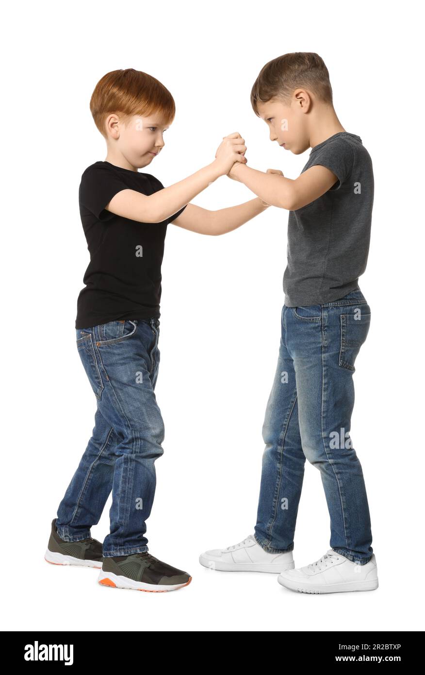 Two boys fighting on white background. Children's bullying Stock Photo ...