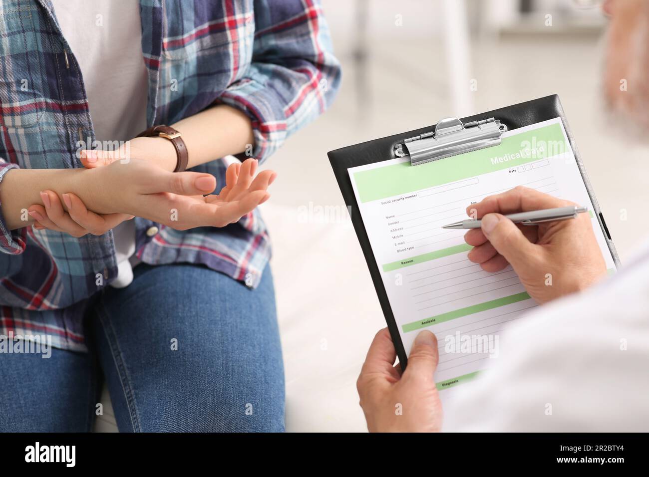 Doctor filling patient's medical card in clinic, closeup Stock Photo ...