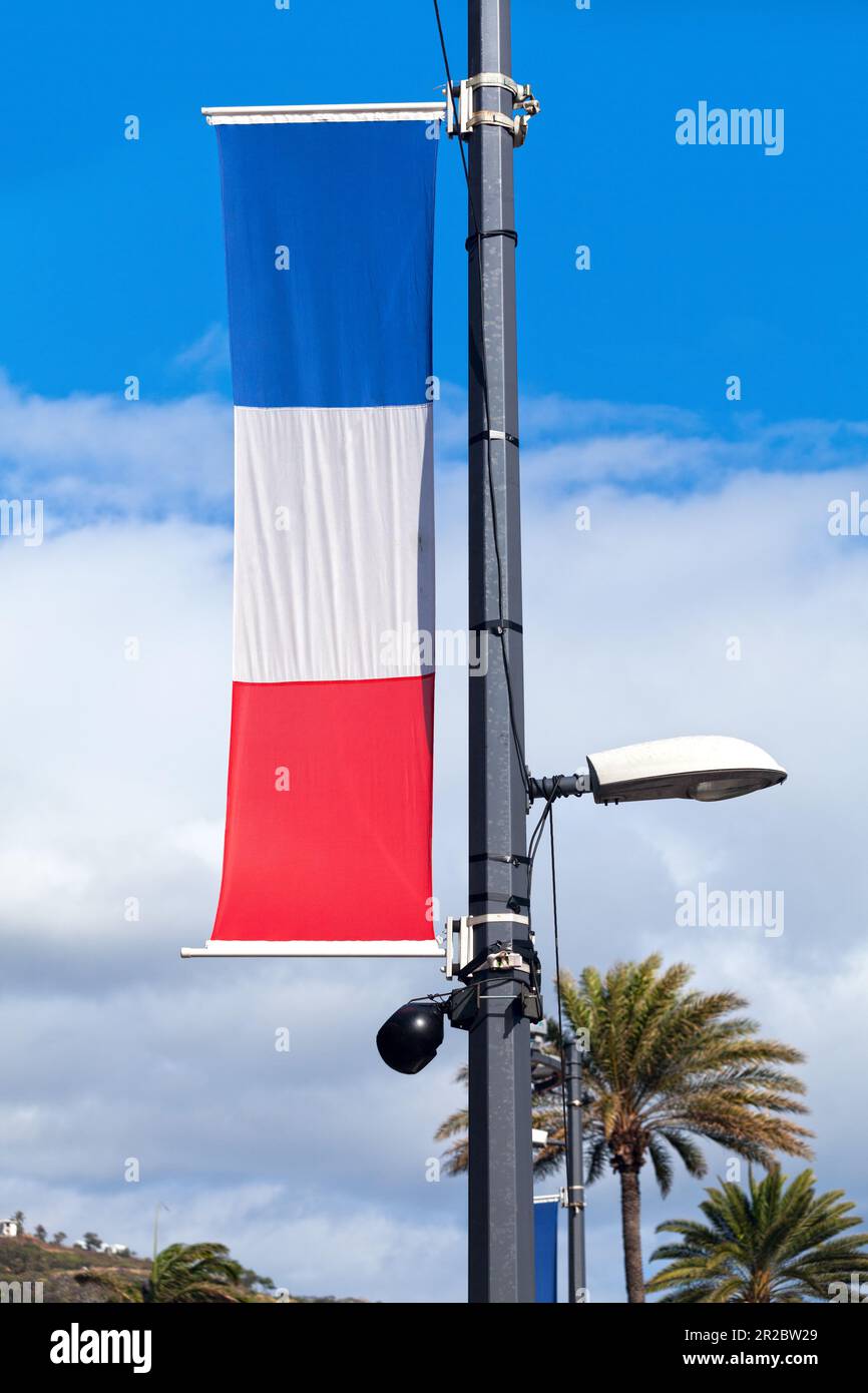 French banner hanging from a lamp post during Bastille Day Stock Photo ...