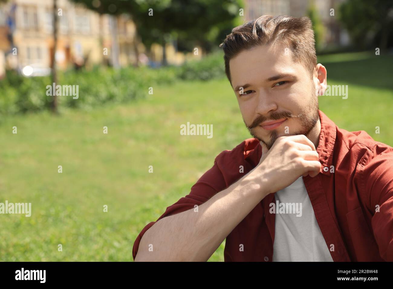 Man touching clothes outside hi-res stock photography and images - Alamy