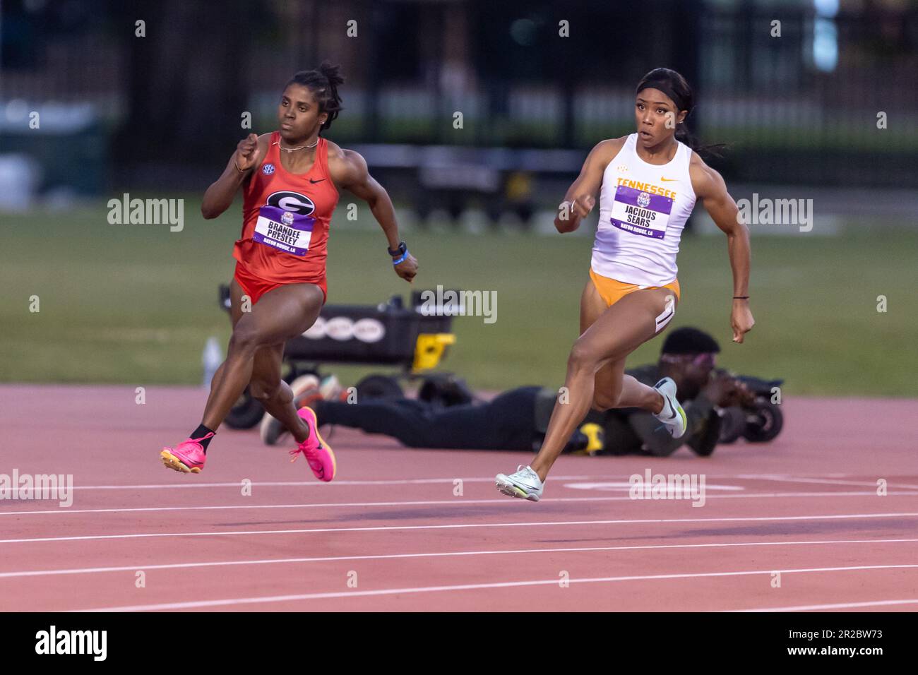 Georgia’s Brandee Presley and Tennessee’s Jacious Sears run the 200 ...