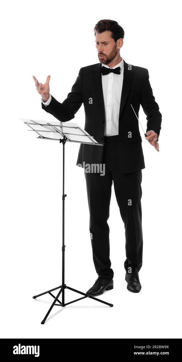 Professional conductor with baton and note stand on white background ...