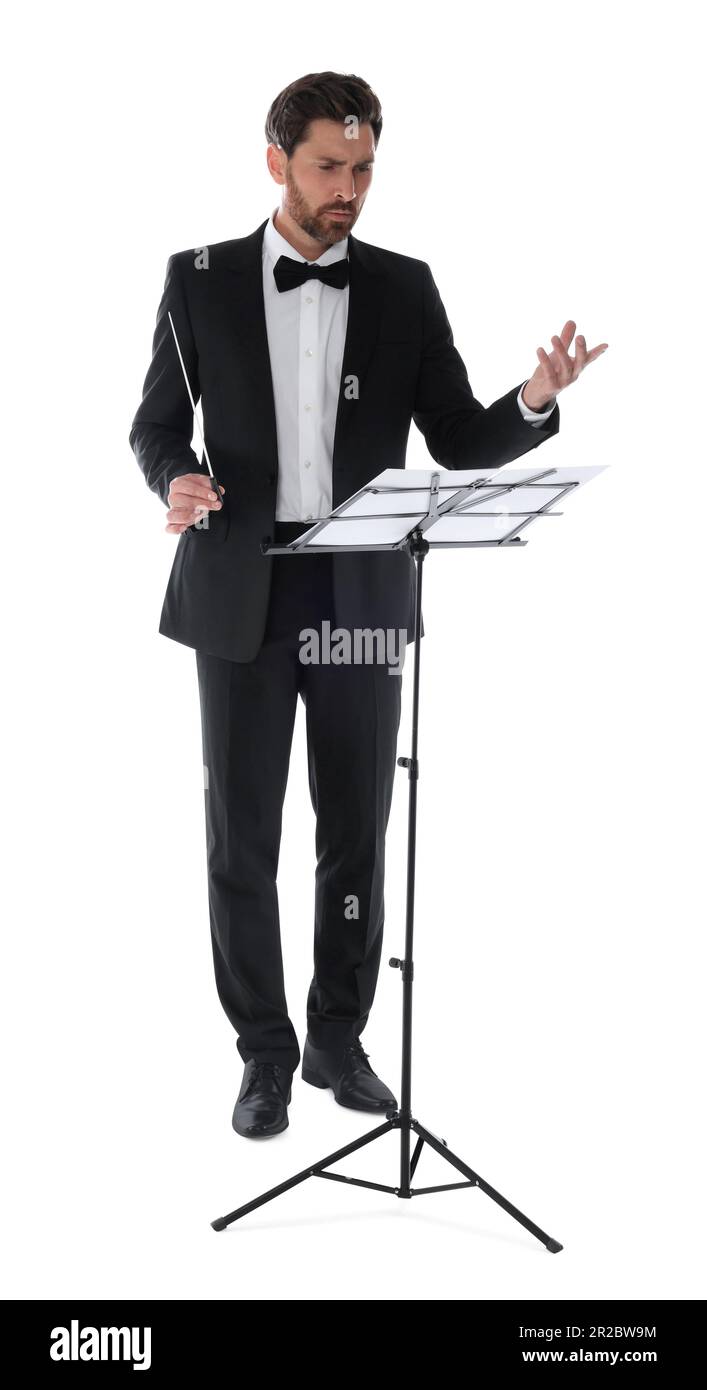 Professional conductor with baton and note stand on white background ...