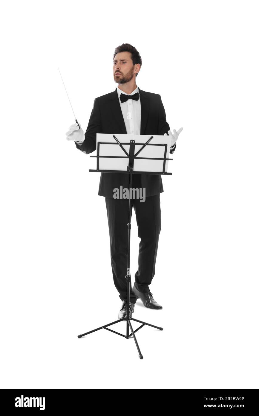 Professional conductor with baton and note stand on white background ...