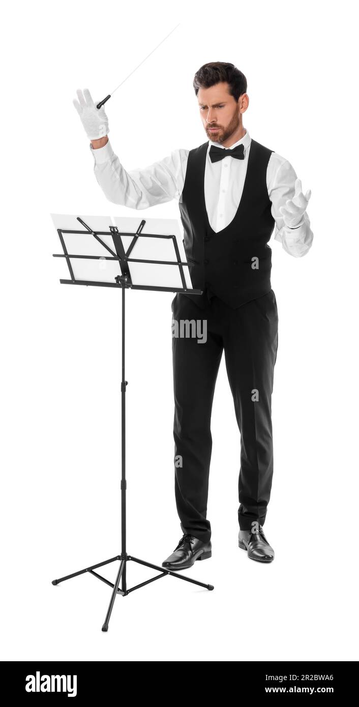 Professional conductor with baton and note stand on white background ...