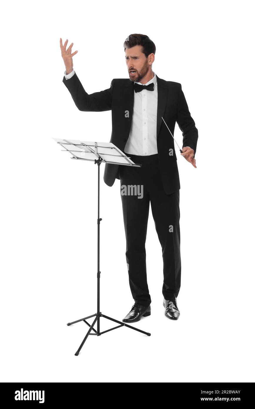 Professional conductor with baton and note stand on white background ...