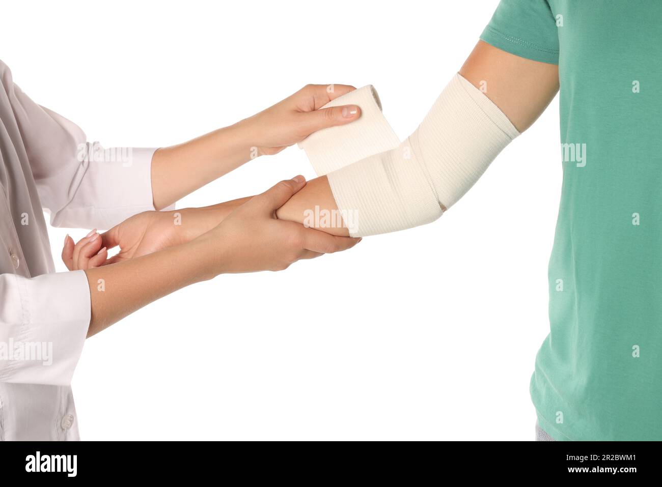 Doctor applying bandage onto patient's arm on white background, closeup ...