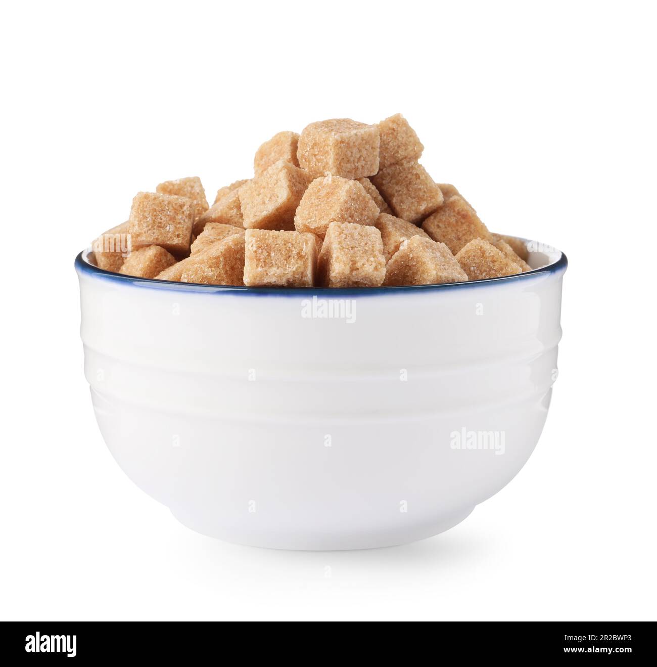 Bowl of brown sugar cubes isolated on white Stock Photo - Alamy