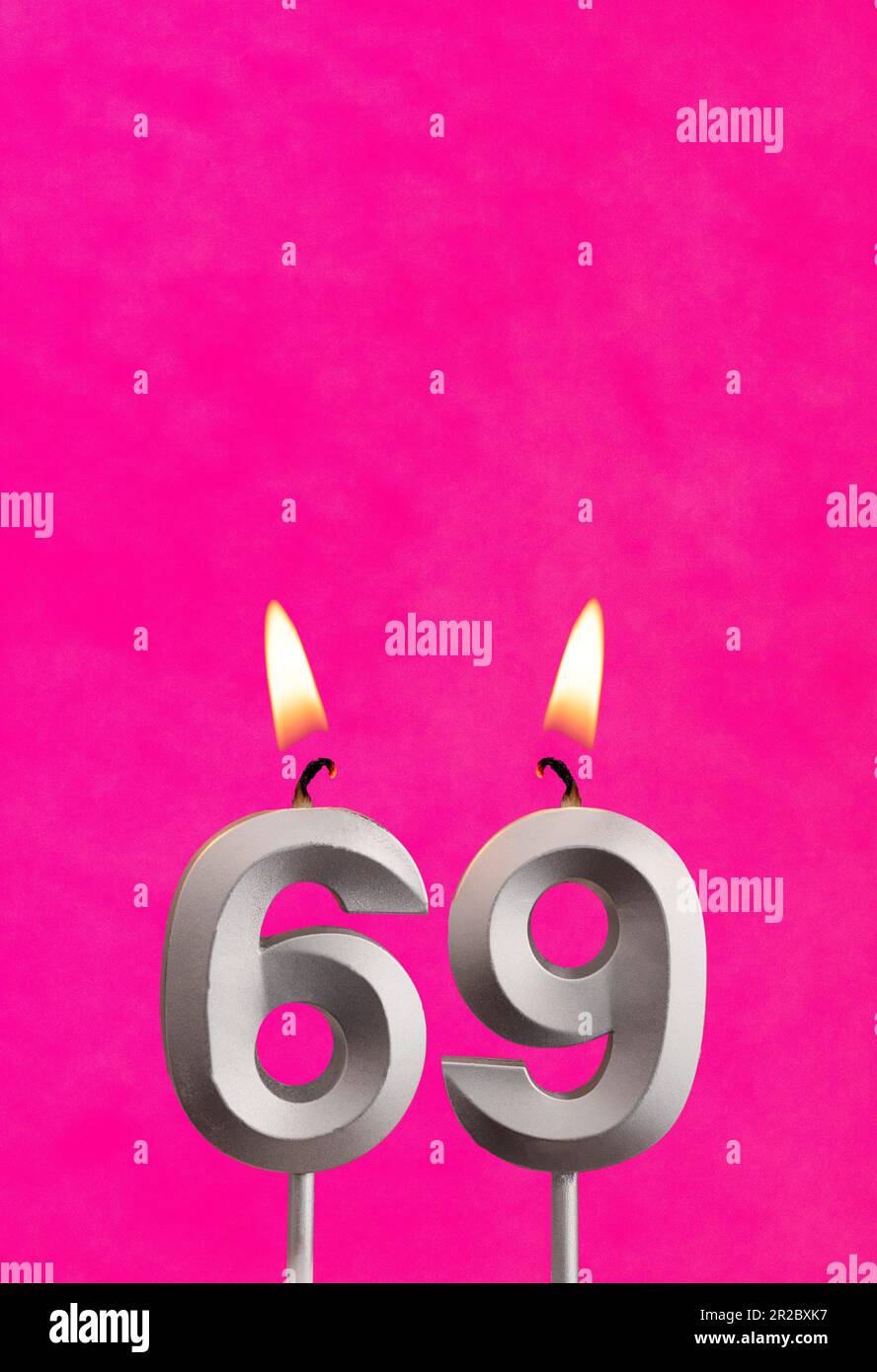 Number 69 candle - Birthday celebration on fuchsia background Stock ...