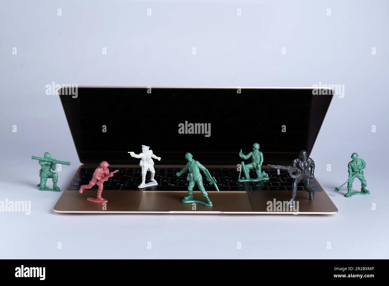 Hybrid warfare concept, online information battle. Laptop and toy ...