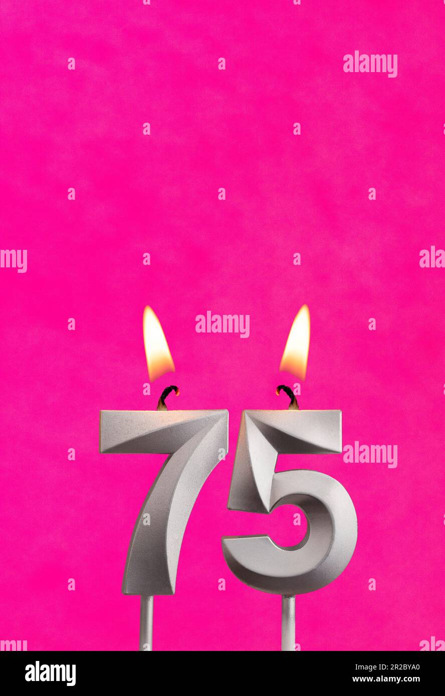 Number 75 candle - Birthday celebration on fuchsia background Stock ...