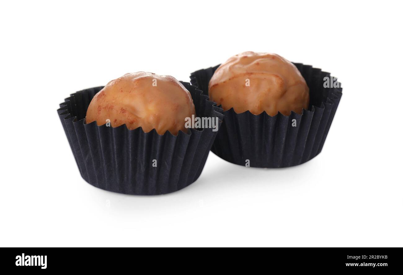 Two tasty chocolate candies isolated on white Stock Photo - Alamy