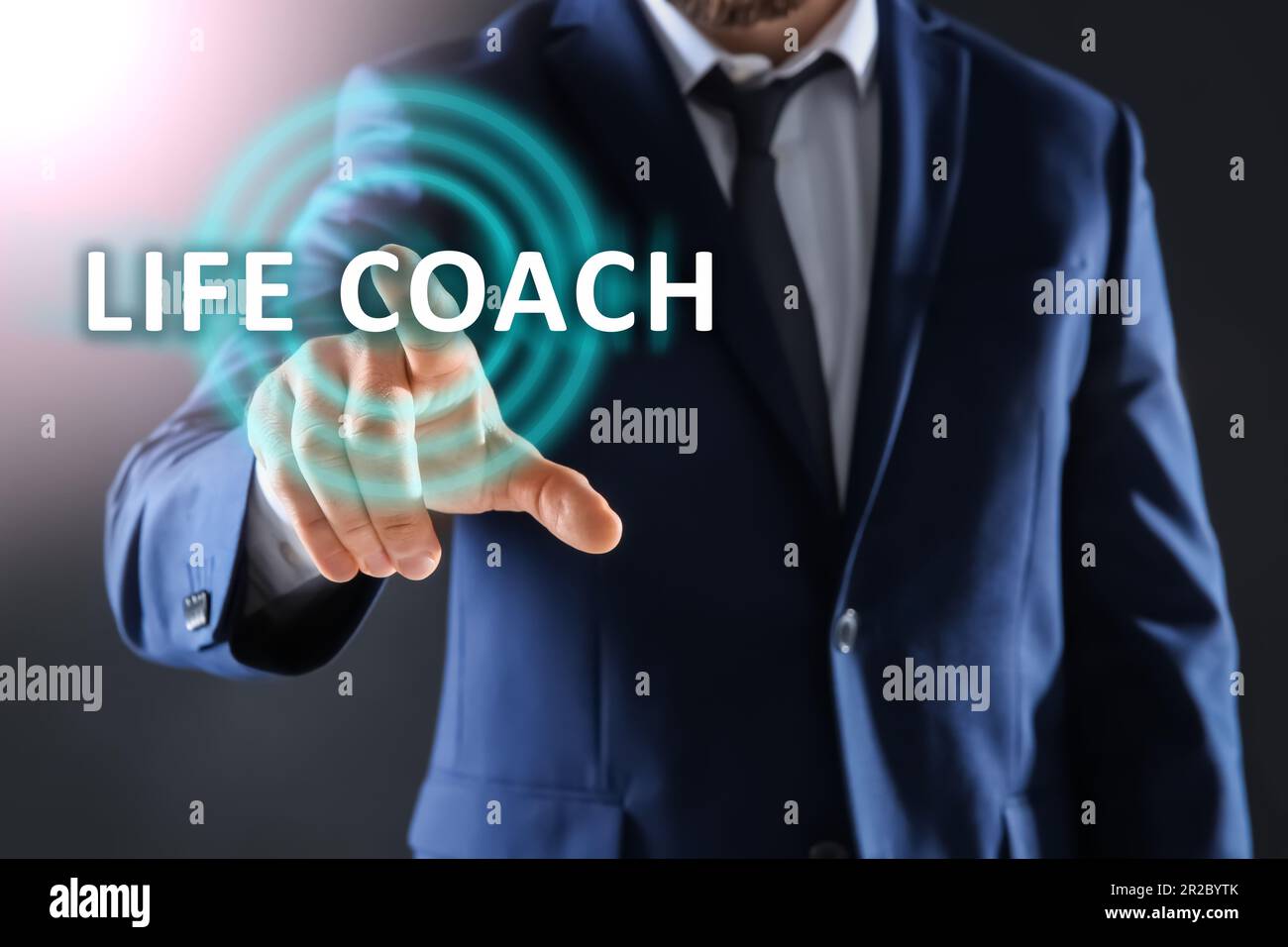 Life coaching concept. Businessman touching virtual screen on dark ...