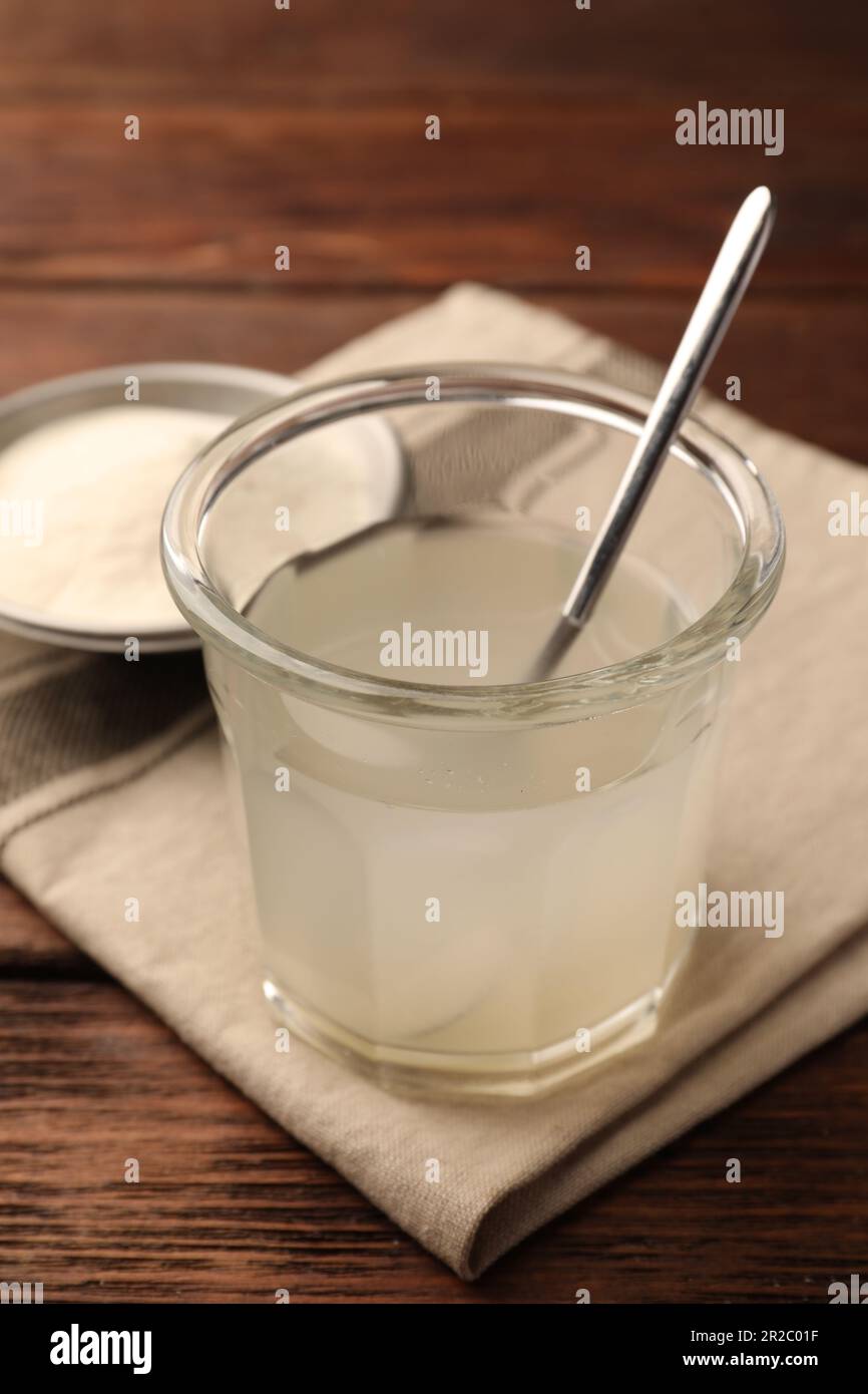 Glass of agar-agar jelly on wooden table Stock Photo - Alamy