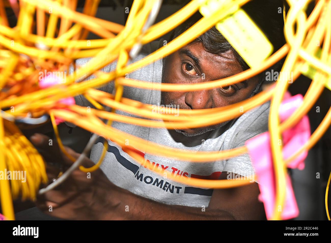 A telecom engineer checks the network link at the transmission room of ...