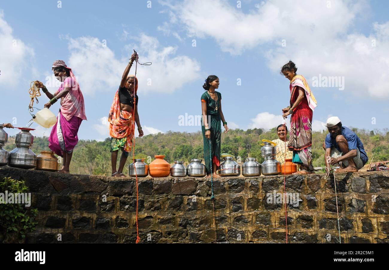 Mumbai, India. 16th May, 2023. Villagers standing on the boundary wall ...