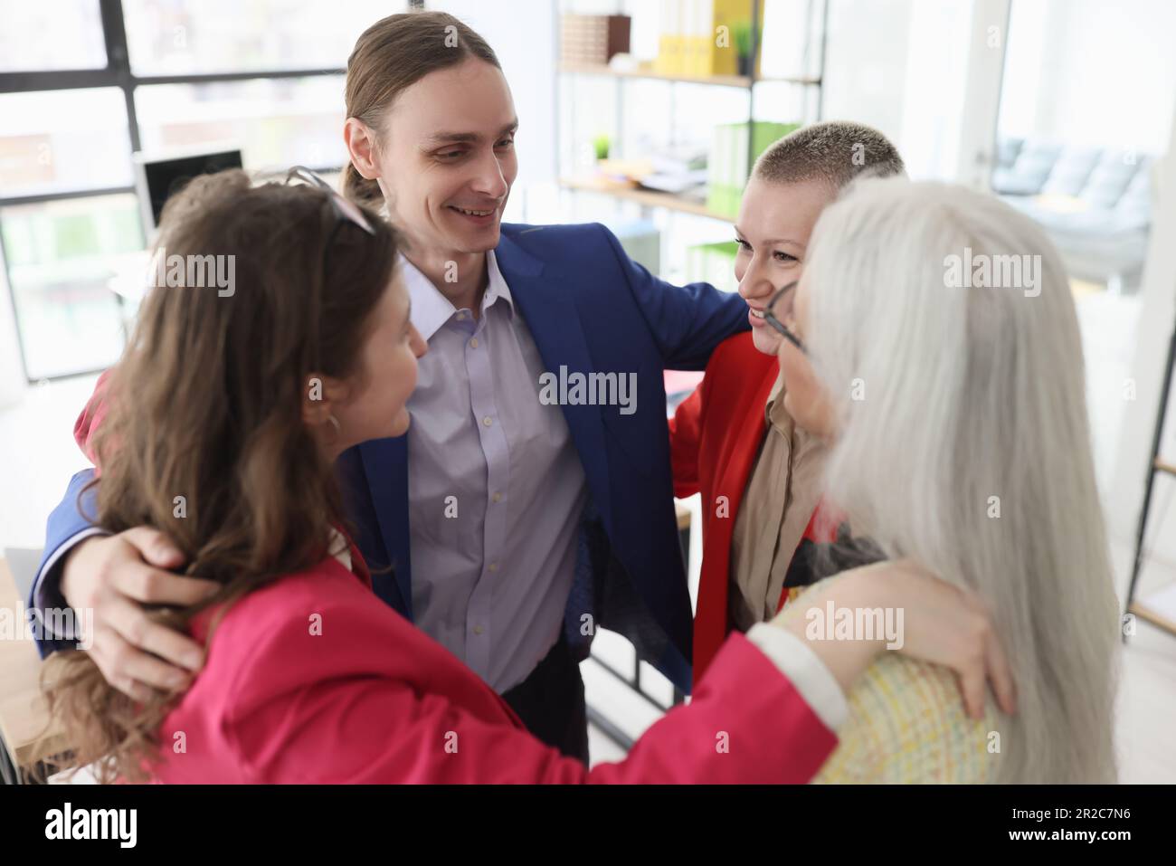 Employees hug hi-res stock photography and images - Alamy