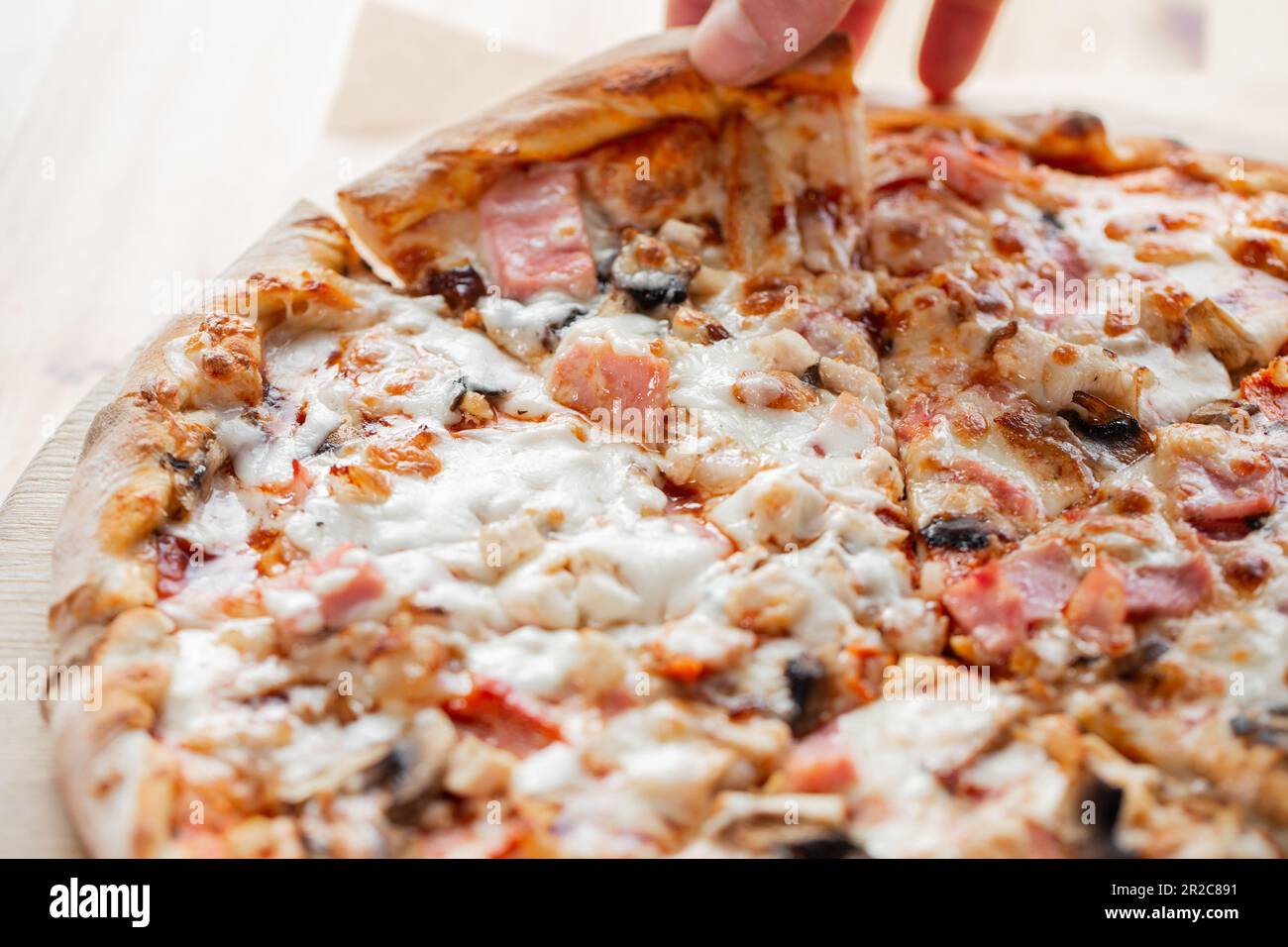 one people taking slices of pizza out of the box. fast delivery of food ...