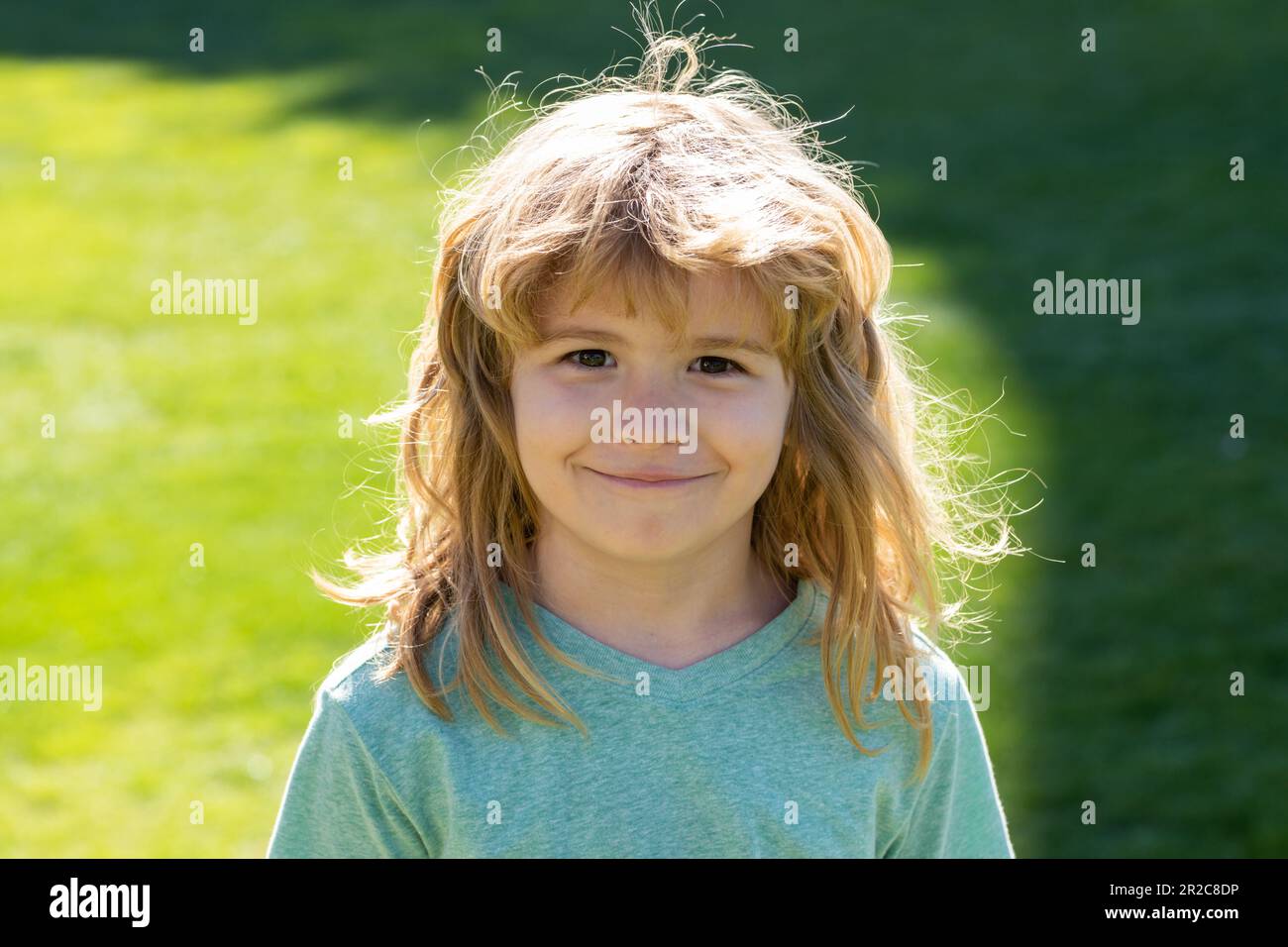 Lifestyle closeup portrait of funny kids face outdoors. Summer kid ...