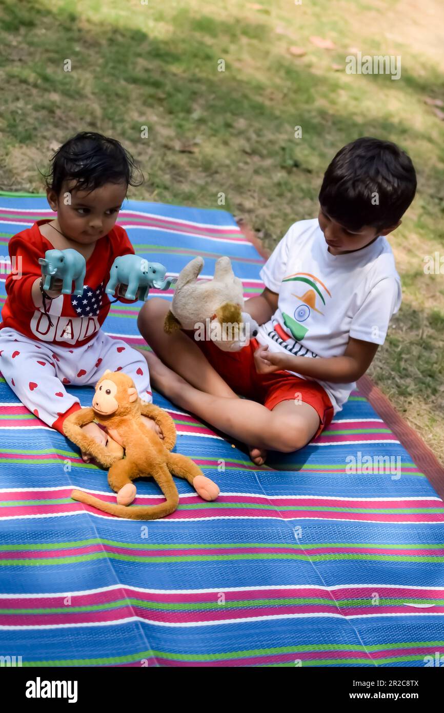 Two happy boys in society park, happy Asian brothers who are smiling ...