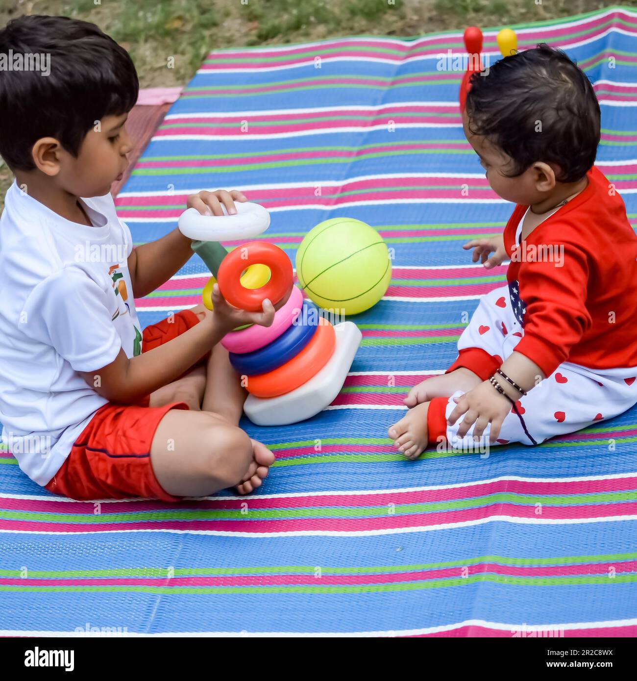 Two happy boys in society park, happy Asian brothers who are smiling ...