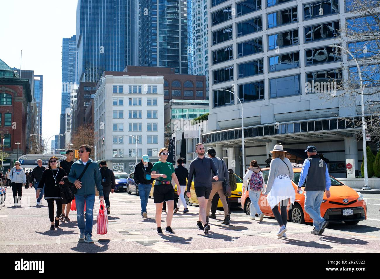 Real life in a big city skyscrapers taxi cars yellow orange walking ...
