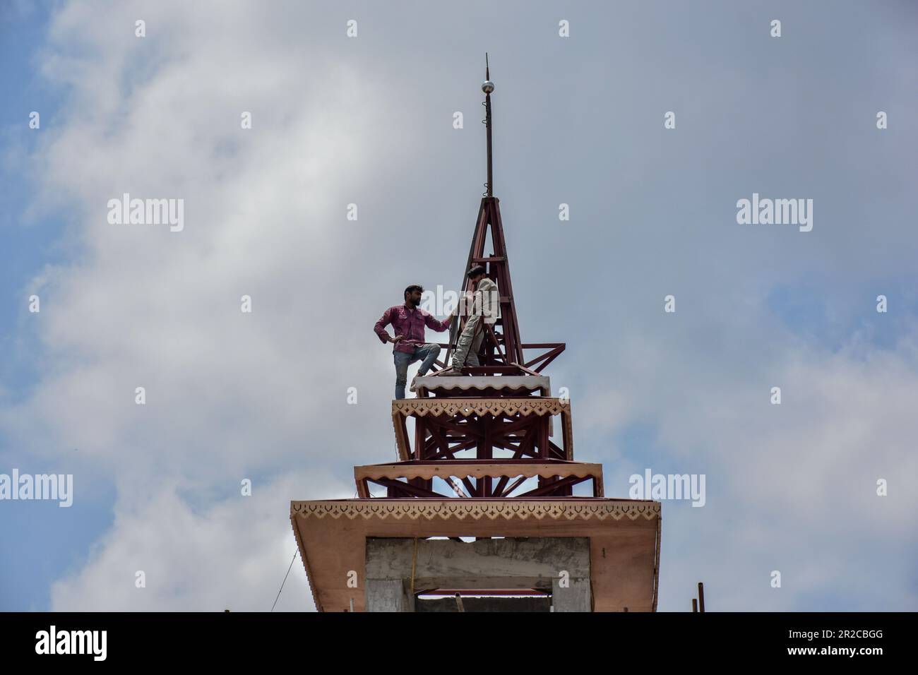 Srinagar, India. 18th May, 2023. Laborers work on the newly renovated ...