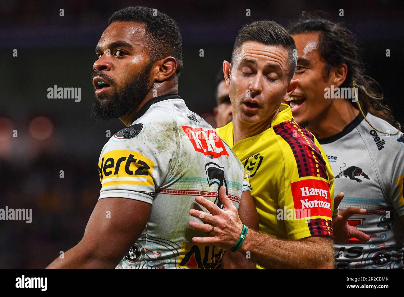 Jarome Luai of the Panthers (right) makes contact with touch judge ...