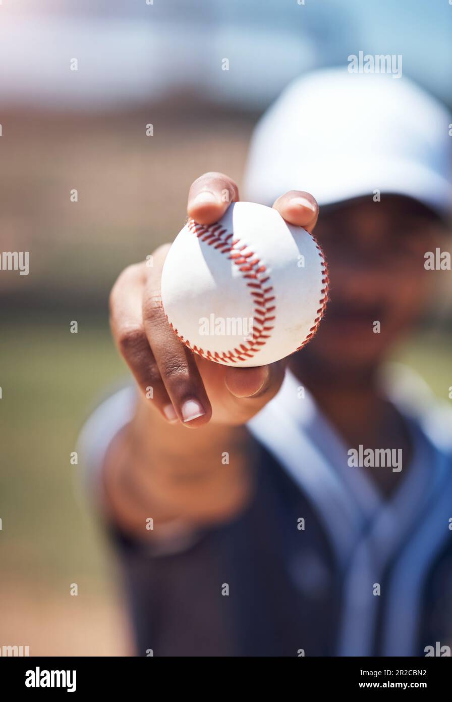 Hand holding baseball, closeup and man for sport, field and training ...