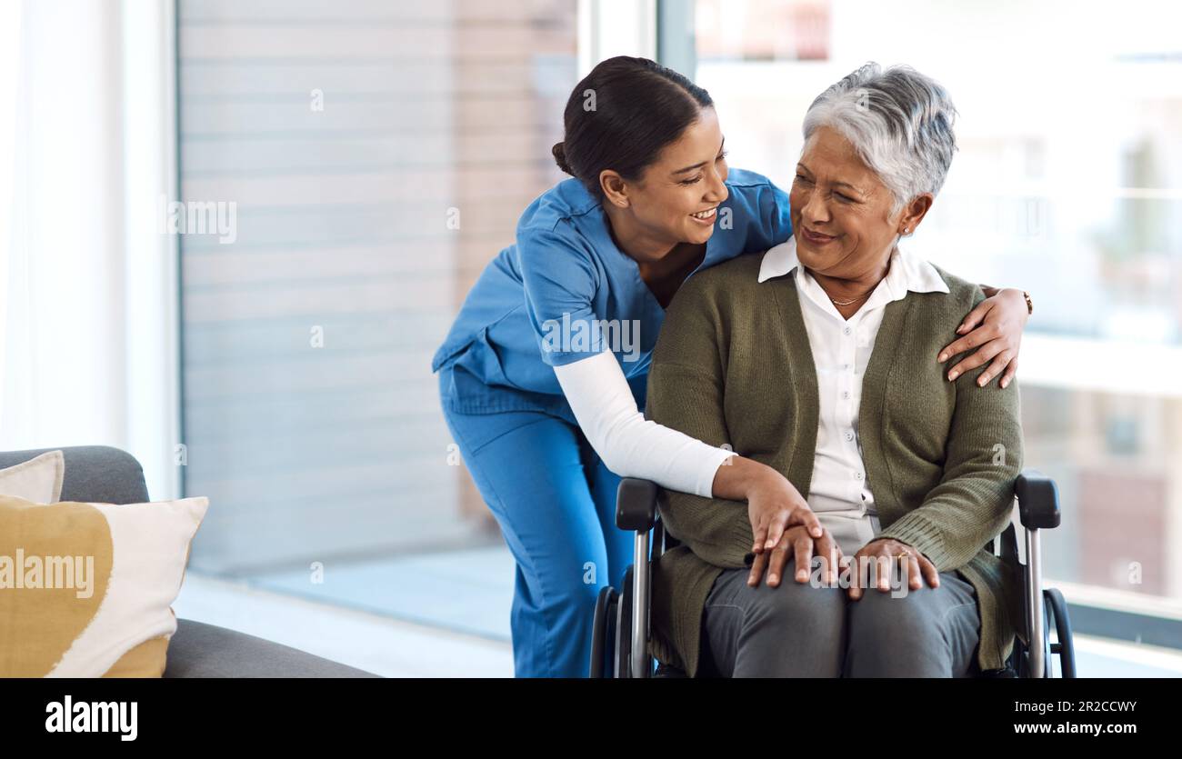 Hug, nurse with senior woman in wheelchair and talking for support ...