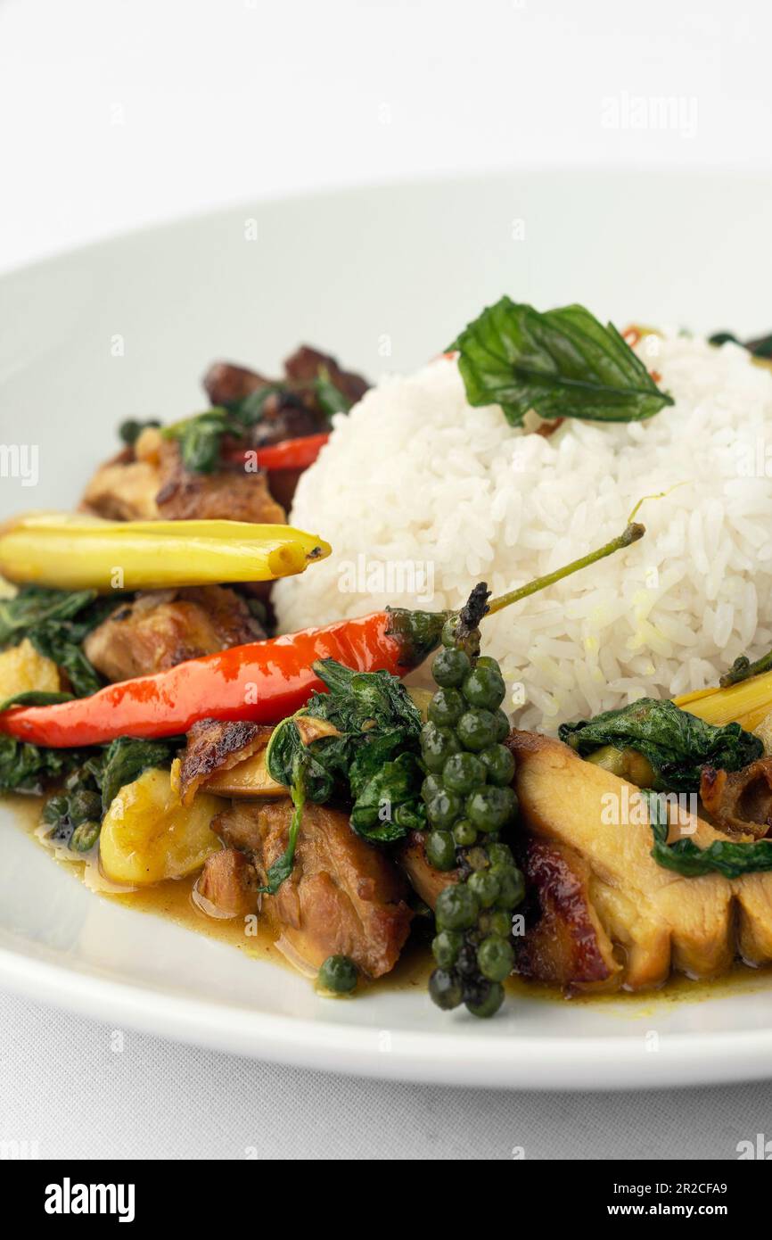 Pad Krapow Gai spicy Thai Chicken Vegetable Stir Fry on white plate ...