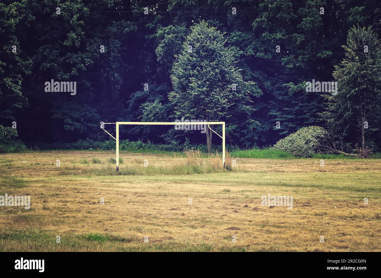 Football goal in an old-school setting. Soccer field and goal post on a ...