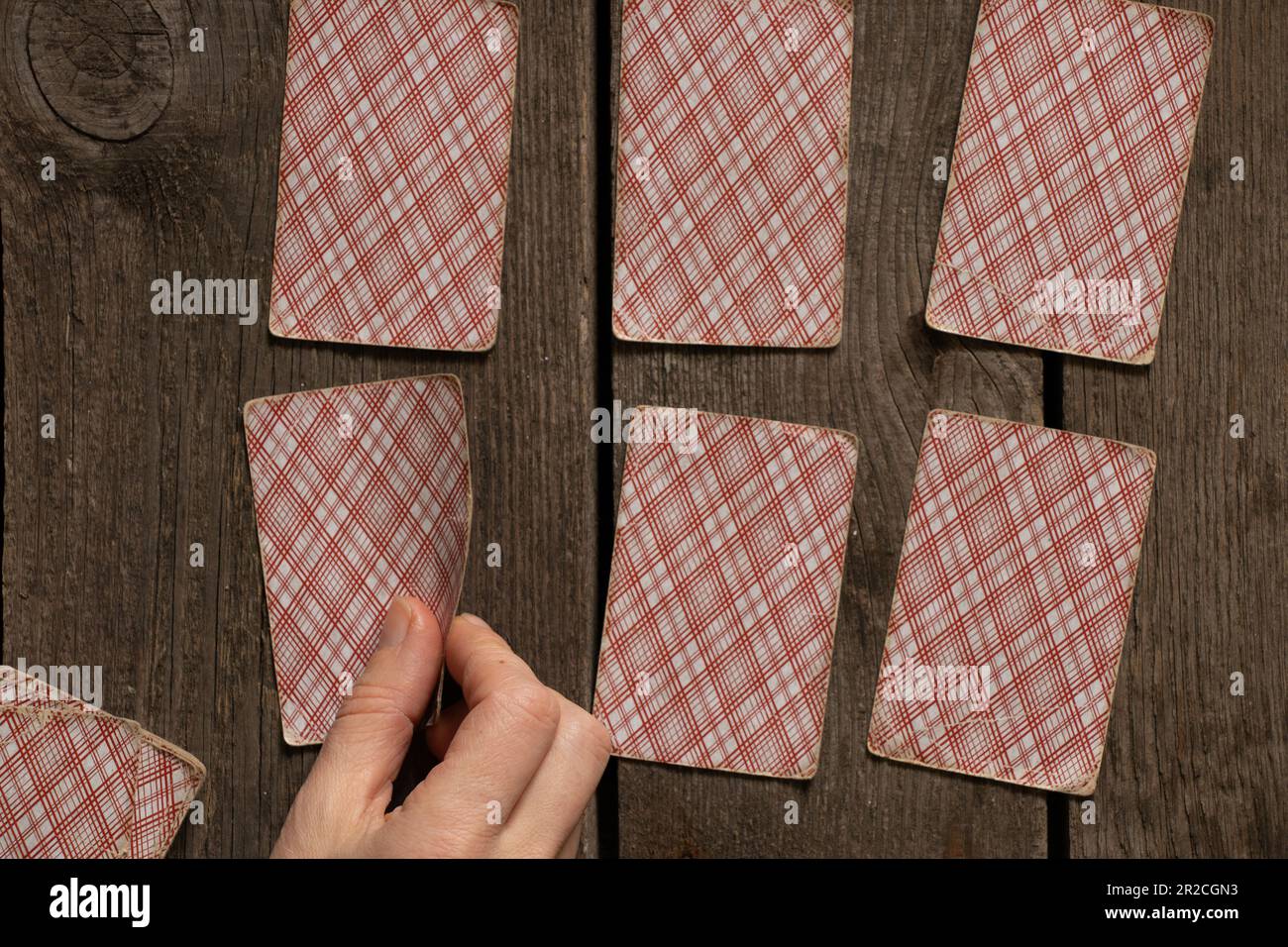 cards laid out on the table and a woman's hand, fortune telling on ...