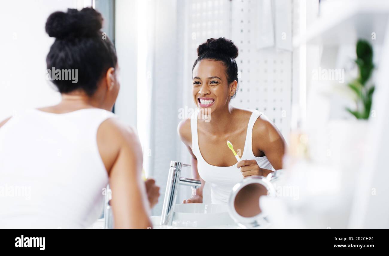 Woman check teeth in mirror, cleaning mouth with toothbrush and ...