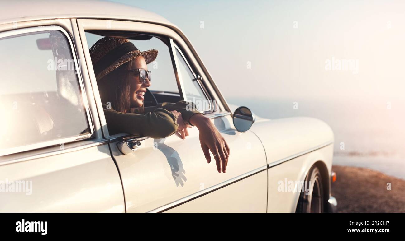 Road trip, window and view with a woman in a car for travel, freedom or ...