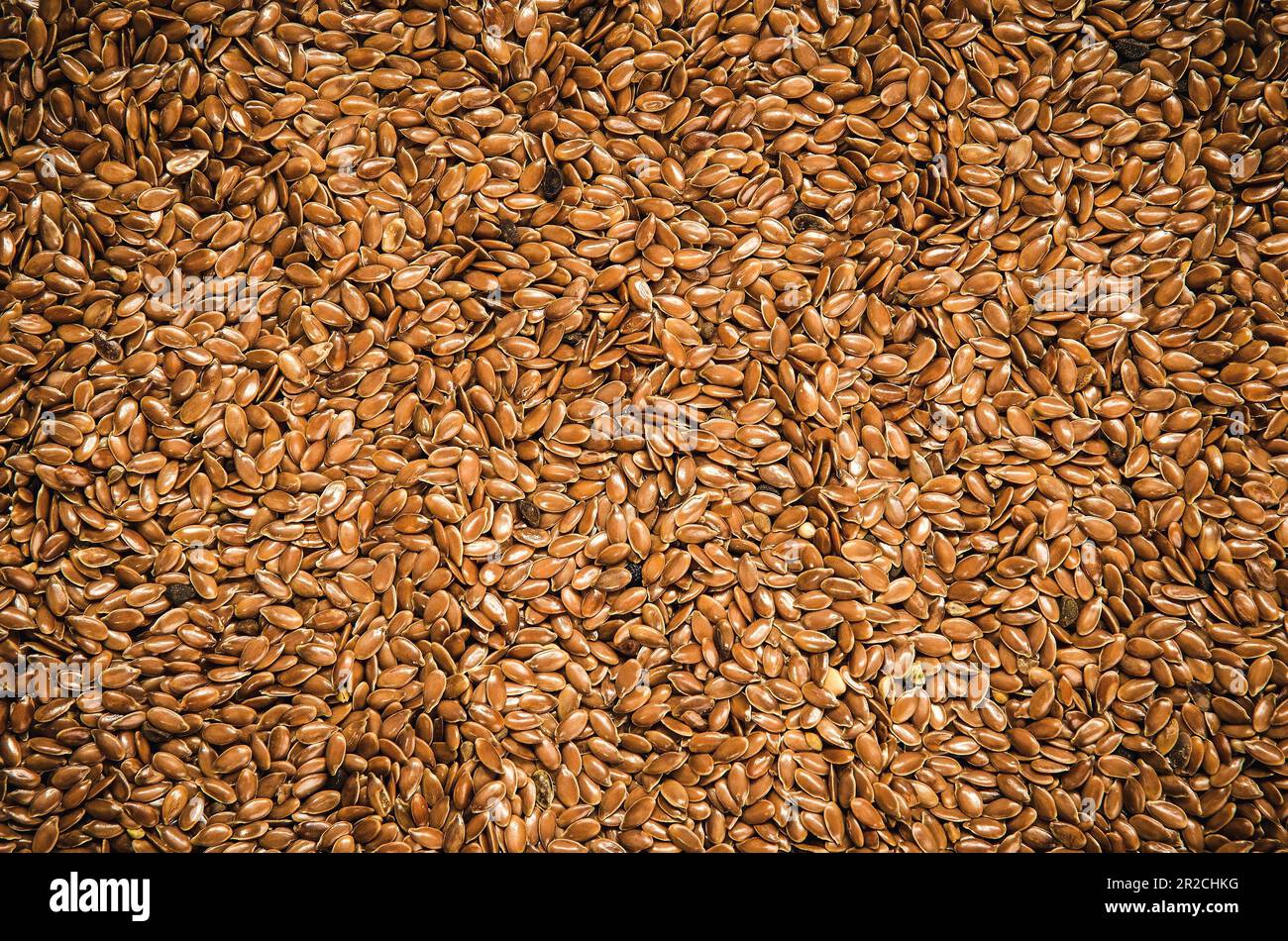 Brown flax seeds. Healthy food on the pile, may be used as background ...