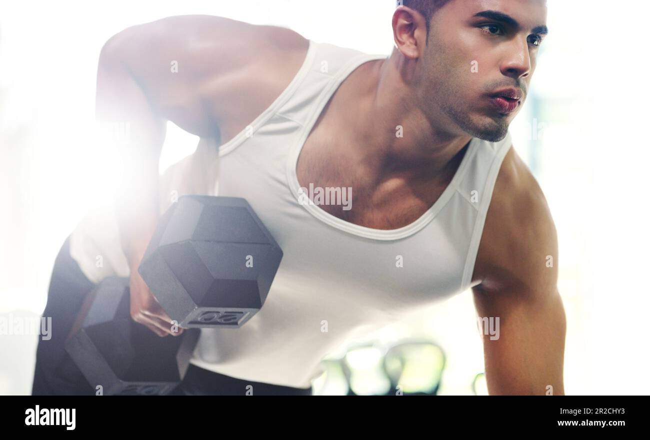 Fitness, dumbbell and a strong sports man in the gym for bodybuilding ...