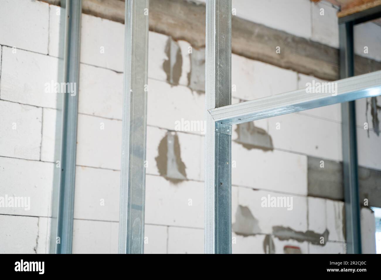 Frame for drywall from a metal profile for a wall close-up on a blurred ...