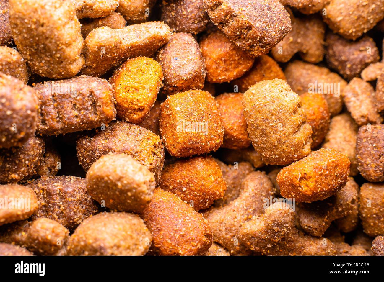 Dry dog food in different shapes close-up Stock Photo - Alamy