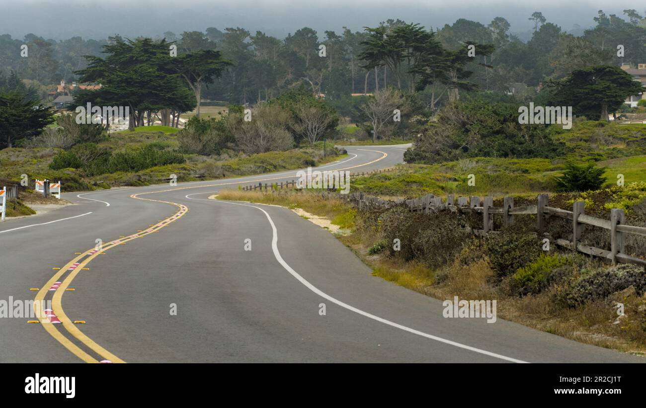 Crooked asphalt road winds through California coast Stock Photo - Alamy