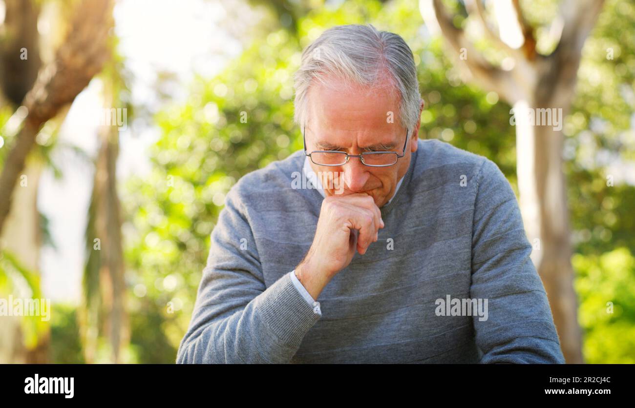 Depression, park and senior man crying while sitting on a bench ...