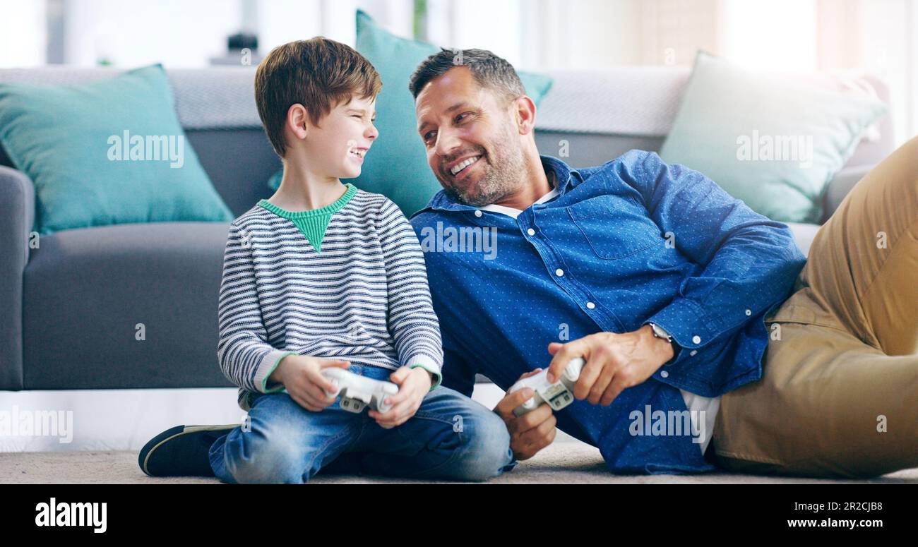Father, child and playing video games for fun bonding, laughing or time ...