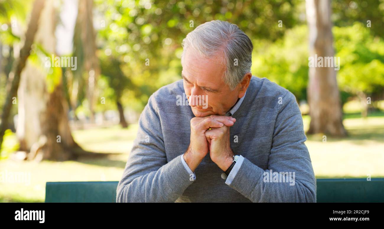 Depression, thinking and senior man in garden sitting on bench for ...
