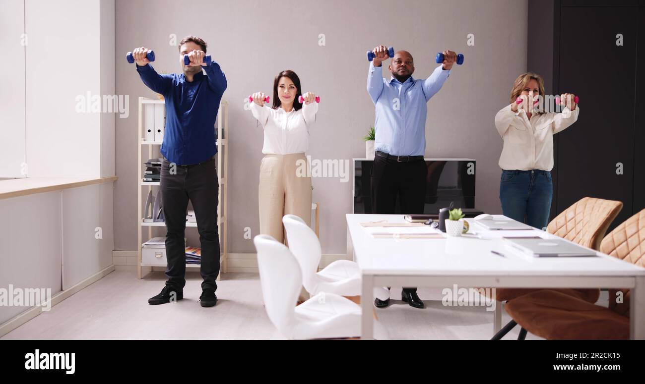 Office Wellness Exercises For Group Of Diverse People Stock Photo - Alamy