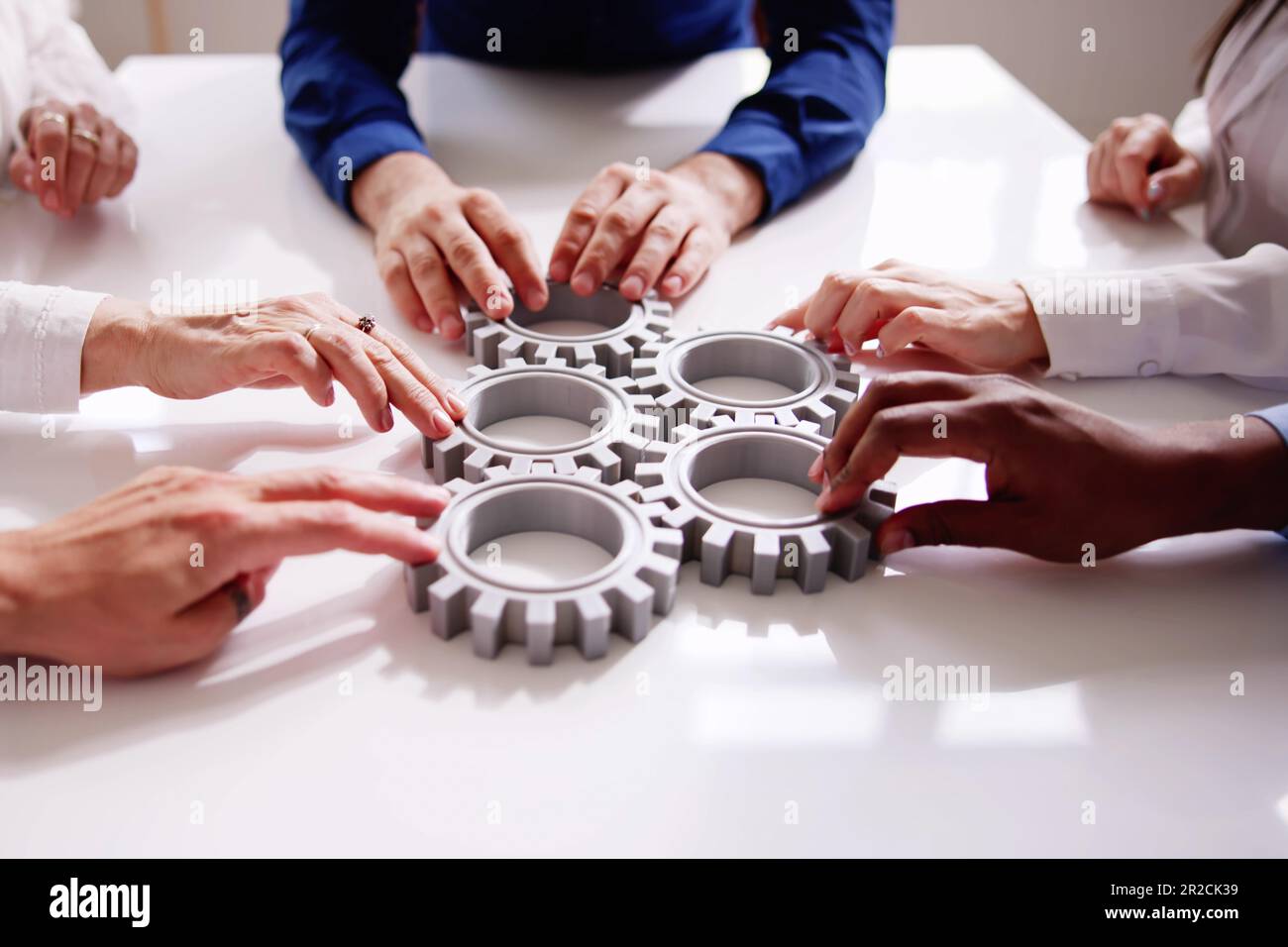 Diverse People Hands Holding Gear Wheels. Business Partnership Stock ...