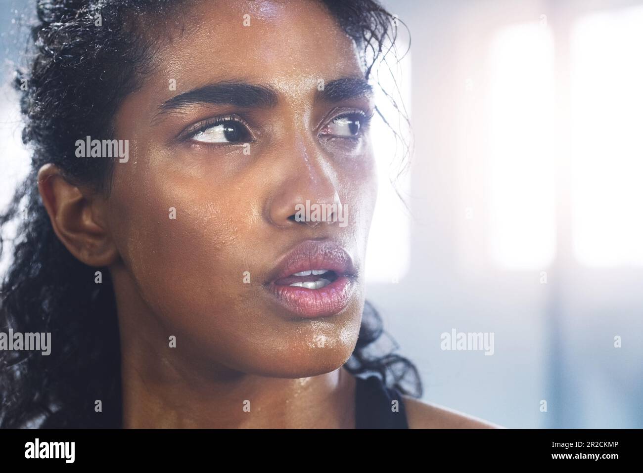 Sweating, woman and breathing while taking a break from fitness ...